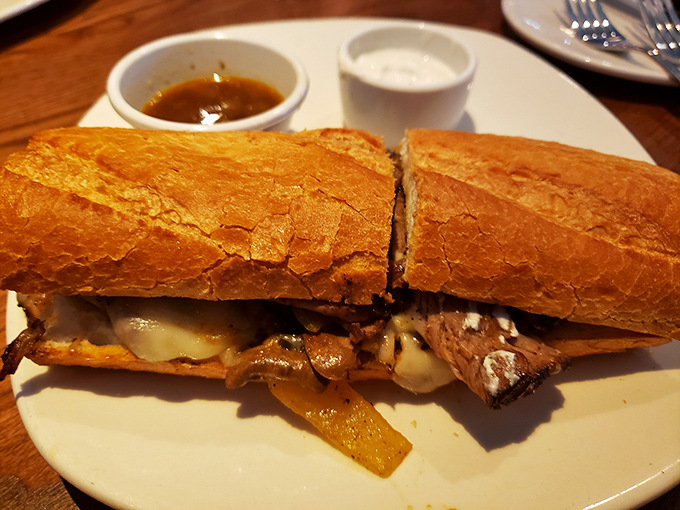 This isn't just a sandwich; it's a architectural marvel of tender prime rib, melted cheese, and crusty bread that demands a two-handed commitment.