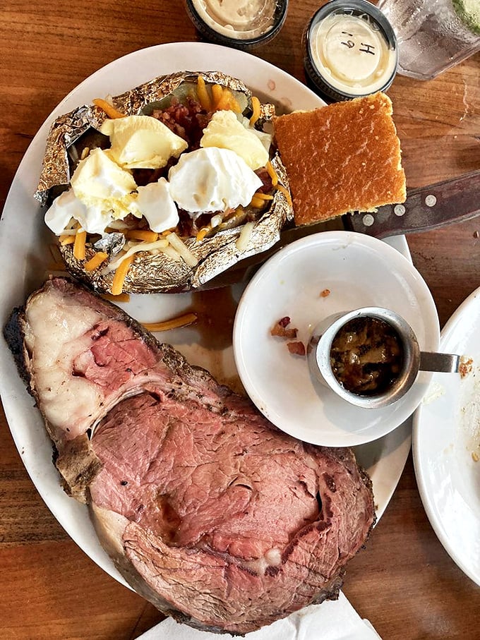 Prime rib with the perfect pink center alongside a loaded baked potato&mdash;proof that sometimes the classics are classics for good reason.