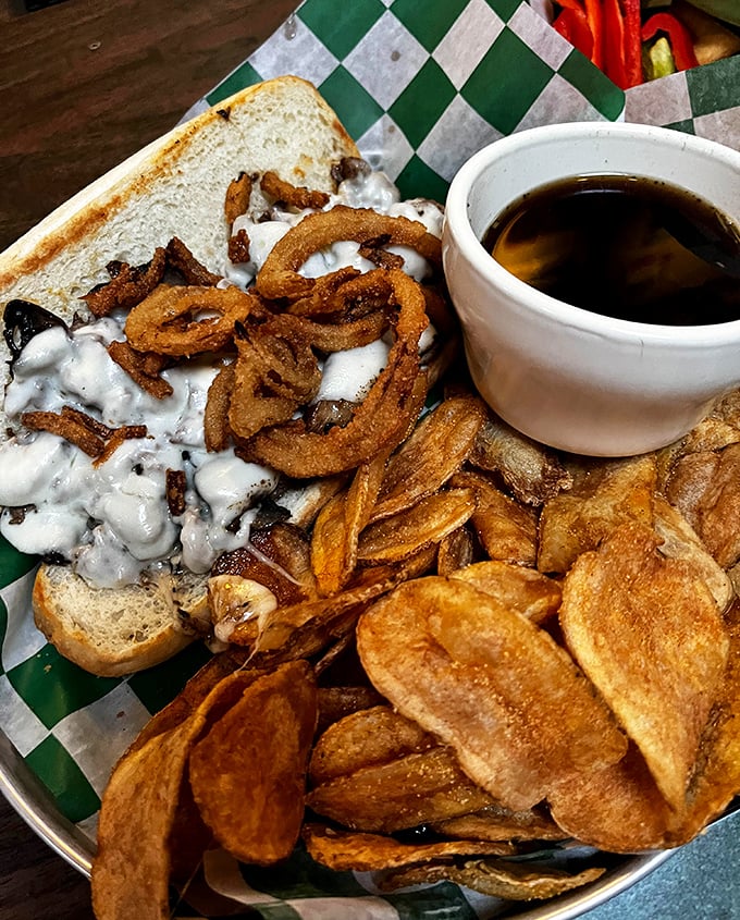 A sandwich that could make a vegetarian question their life choices, complete with crispy onion rings.