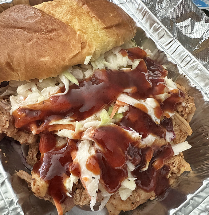 This isn't just a sandwich&mdash;it's an architectural masterpiece of pulled chicken, slaw, and sauce that requires both hands and several napkins.