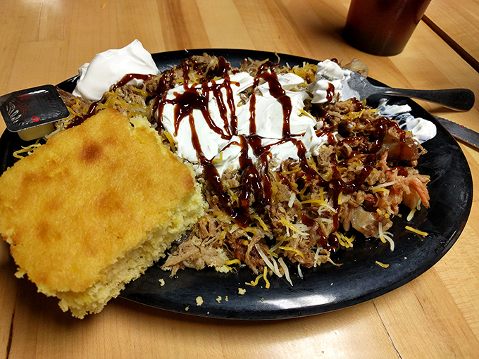 This loaded pulled pork plate isn't just dinner&mdash;it's an edible Jackson Pollock, where BBQ sauce drizzles are artistic expressions of flavor.