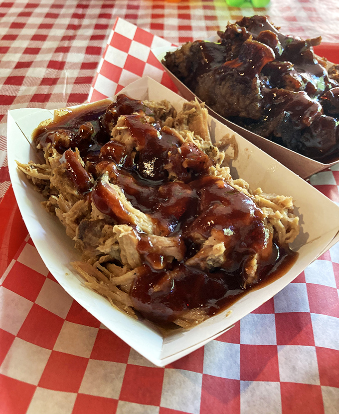 Pulled pork that surrenders to the gentlest touch, bathed in sauce that strikes the perfect balance between sweet, tangy, and "please don't make me share this."