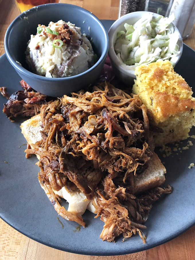 Pulled pork piled this high requires architectural engineering and possibly a forklift to finish, but you'll try anyway.