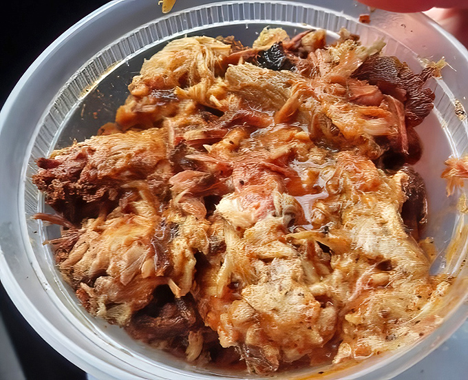 Pulled pork so tender it practically surrendered to the pitmaster, waiting patiently to be the highlight of your week.