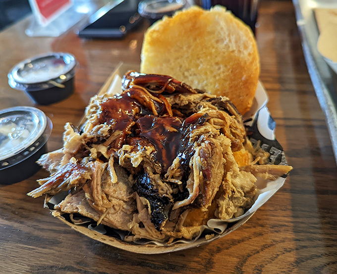 This pulled pork sandwich isn't just a meal, it's an architectural marvel&mdash;a delicious tower of tender meat that somehow maintains structural integrity until the last bite.