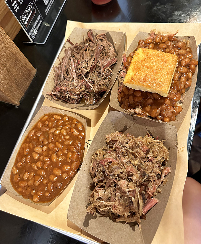 A BBQ sampler that answers life's most important question: "Why choose one meat when you can have them all?" The cornbread is just the golden bonus.