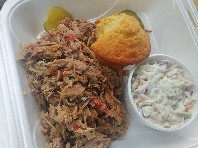 Pulled pork that doesn't need a fancy introduction&mdash;just a willing mouth and maybe a napkin or twelve. The cornbread and slaw aren't mere sides, they're supporting actors in a meaty drama.
