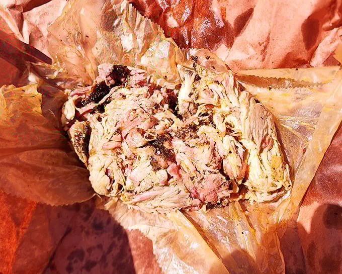 Pulled pork so tender it surrenders completely, nestled in butcher paper like the precious treasure it is. No fork necessary&mdash;just willing fingers.