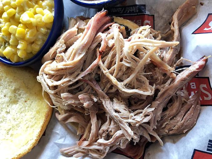 Pulled pork so tender it practically surrendered to gravity, served with sweet corn and Texas toast&mdash;a plate that speaks fluent comfort food.