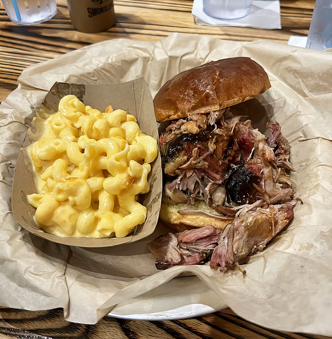 The pulled pork sandwich &ndash; a masterpiece of smoke and tenderness &ndash; sits beside mac and cheese so golden it could fund your retirement.