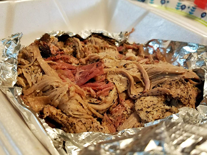 Pulled pork so tender it looks like it's been combed rather than pulled, with bark pieces that deliver flavor explosions in every bite.