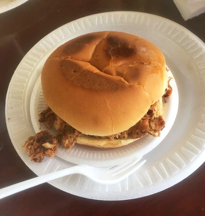 The pulled pork sandwich arrives without fanfare, but one bite reveals why simplicity is the ultimate sophistication in barbecue circles.