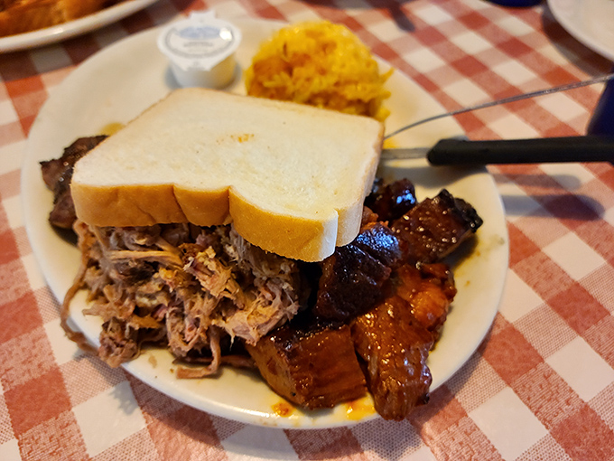 A pulled pork sandwich so generous, it requires a strategic approach and extra napkins.