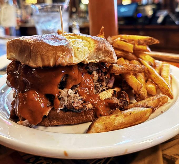 This isn't just a sandwich&mdash;it's an architectural marvel of pulled pork, sauce, and bread that requires both hands and zero shame.