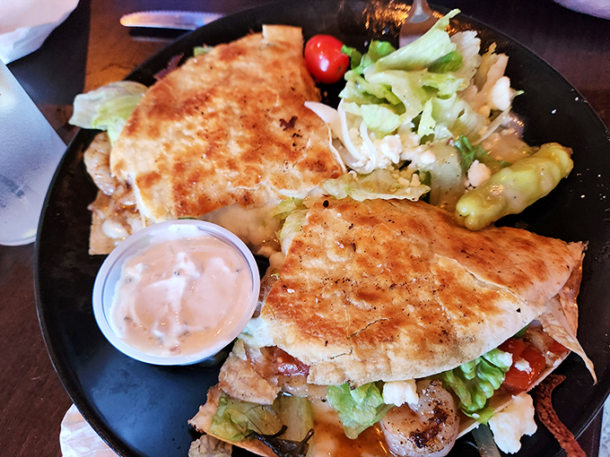 The quesadilla arrives golden and crisp, a reminder that Higher Ground isn't just a one-trick pony in burger country.