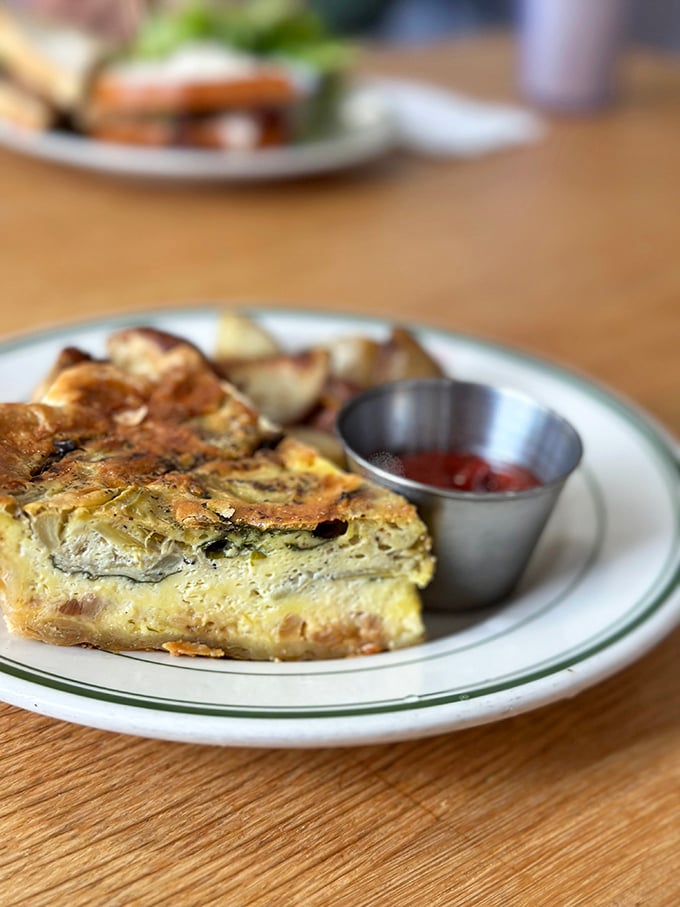 This quiche doesn't mess around&mdash;golden crust, perfectly set filling, and a side of potatoes. Breakfast of champions, or anyone with taste buds.