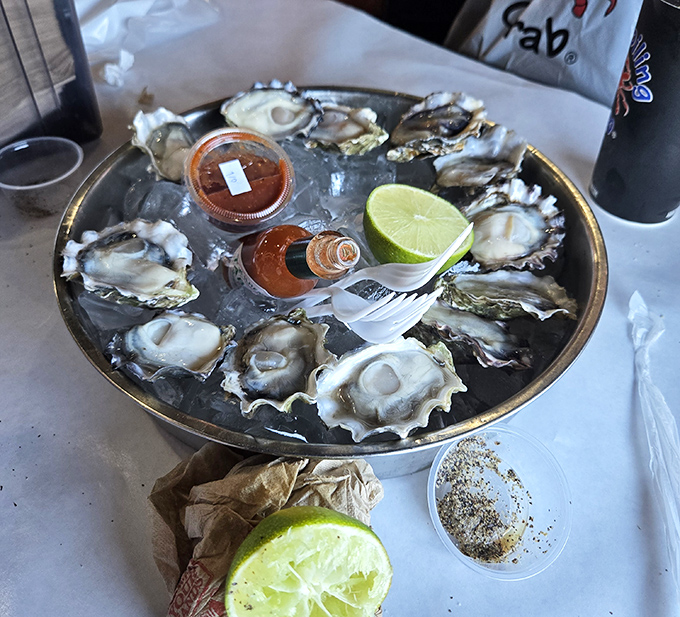 Fresh oysters on ice with cocktail sauce and lime prove that sometimes the simplest preparations are the most sophisticated indulgences.