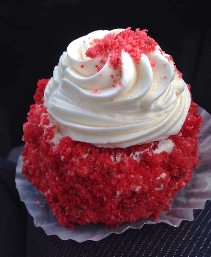 The red velvet cupcake doesn't whisper its presence&mdash;it announces itself with a crown of cream cheese frosting fit for bakery royalty.