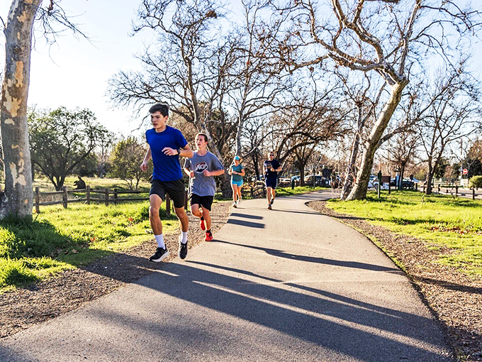 Locals jog through tree-lined paths where sunshine filters through branches&mdash;nature's way of saying "who needs an expensive gym membership anyway?"