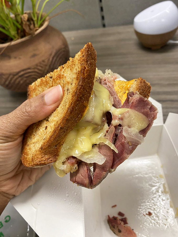 A proper pastrami sandwich isn't just lunch; it's an architectural marvel of meat, cheese, and bread that demands to be admired before devouring.