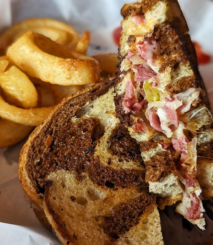 The Reuben sandwich: where corned beef, sauerkraut and melted cheese perform a harmonious dance that would make Broadway choreographers weep with joy.