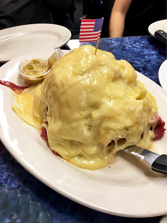 Not so much a Reuben as a golden monument to melted cheese, with enough corned beef hiding underneath to feed a small village.