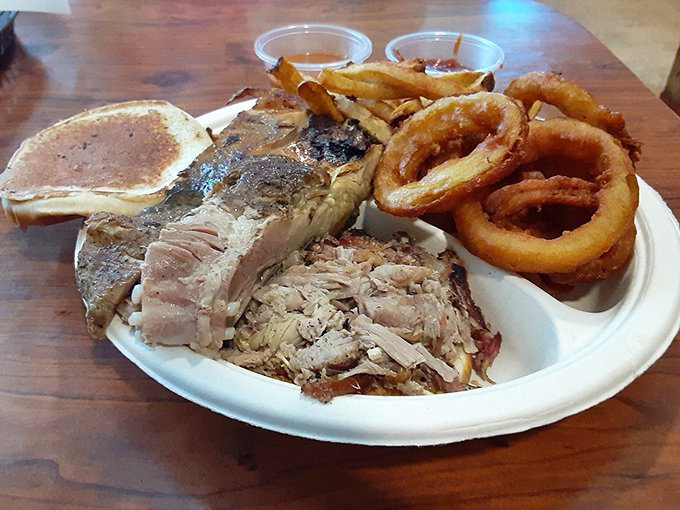 A barbecue plate that doesn't mess around&mdash;tender smoked meat alongside golden onion rings that shatter with each bite.