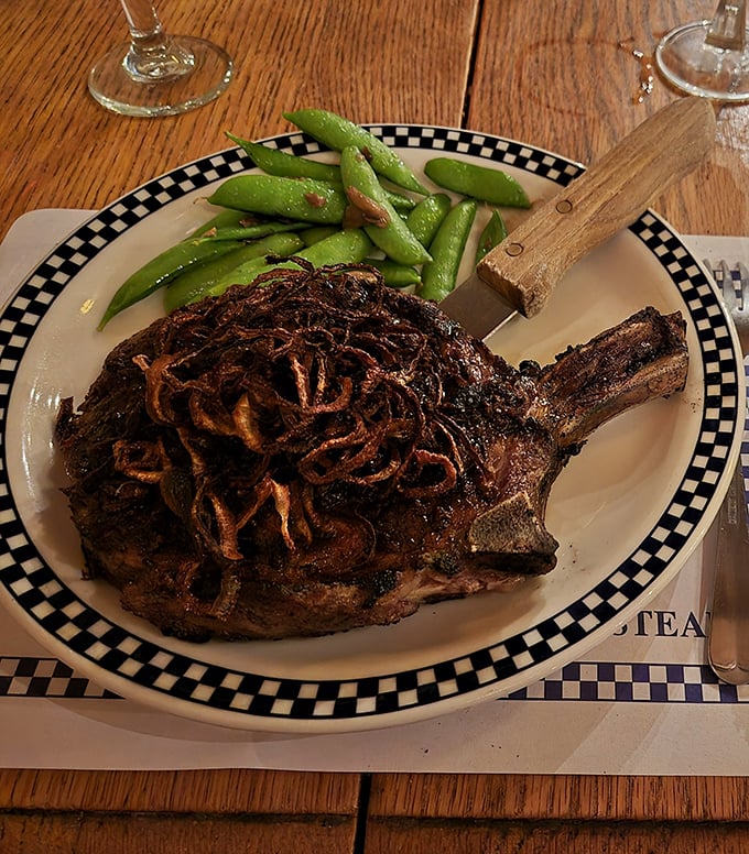 A bone-in ribeye topped with crispy onions and served with vibrant snap peas &ndash; proof that sometimes the classics need very little improvement.