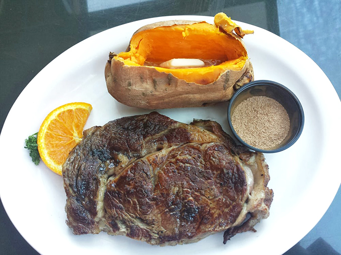 This ribeye arrives with a sweet potato that could double as a canoe for very small paddlers.
