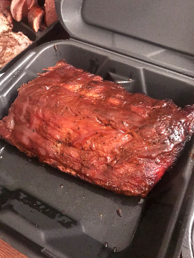 These ribs have clearly been involved in a long, passionate relationship with smoke. The glossy exterior tells stories that your taste buds need to hear.