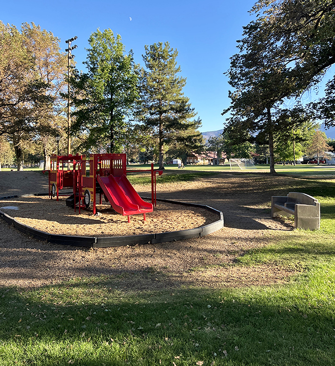 Riverside Park offers playground nostalgia with a side of pine-scented air that's better than any spa treatment.