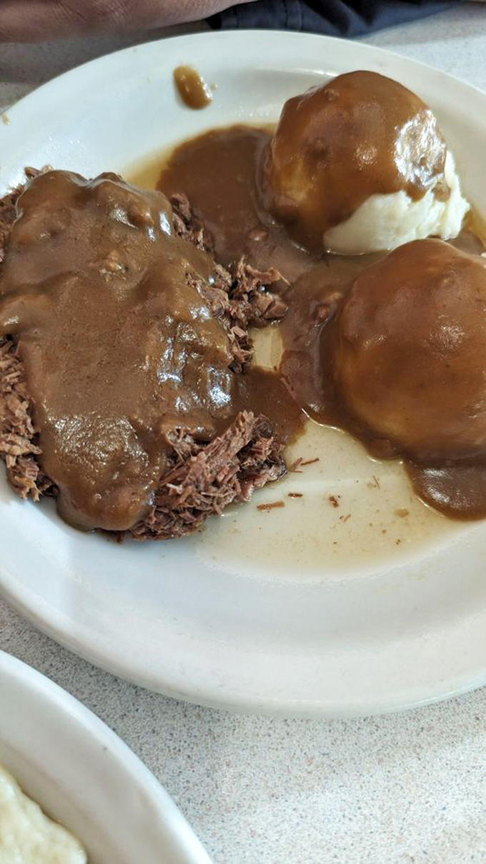 Roast beef that doesn't need Instagram filters&mdash;tender, slow-cooked meat swimming in rich gravy alongside pillowy mashed potatoes. Comfort defined.