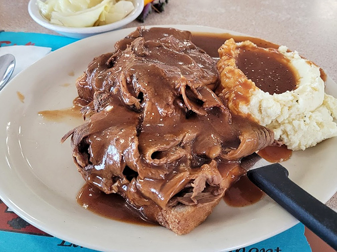 The hot beef sandwich&mdash;where gravy isn't just an option, it's a lifestyle choice that smothers your worries along with the bread.