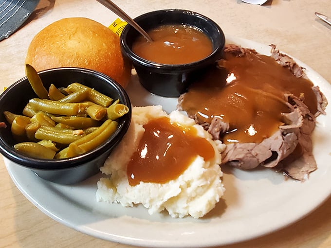 Roast beef done right &ndash; tender slices bathed in rich gravy alongside green beans and mashed potatoes. Grandma would approve, then ask for seconds.
