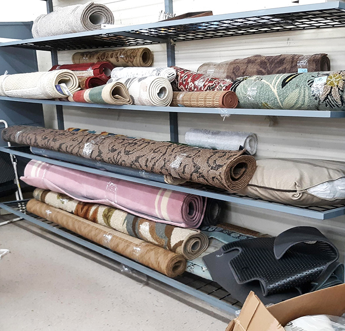 The rug section: where your next conversation piece lies rolled up like a scroll containing the secret to tying a room together.