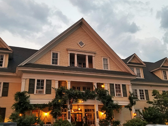 Sage Restaurant glows at dusk like a Victorian postcard come to life, with climbing vines that seem to hug the building in botanical appreciation.