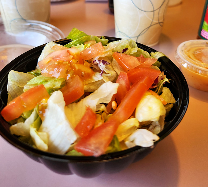 Fresh, crisp salad with vibrant tomatoes proves Joe's doesn't cut corners on anything, even the sides.