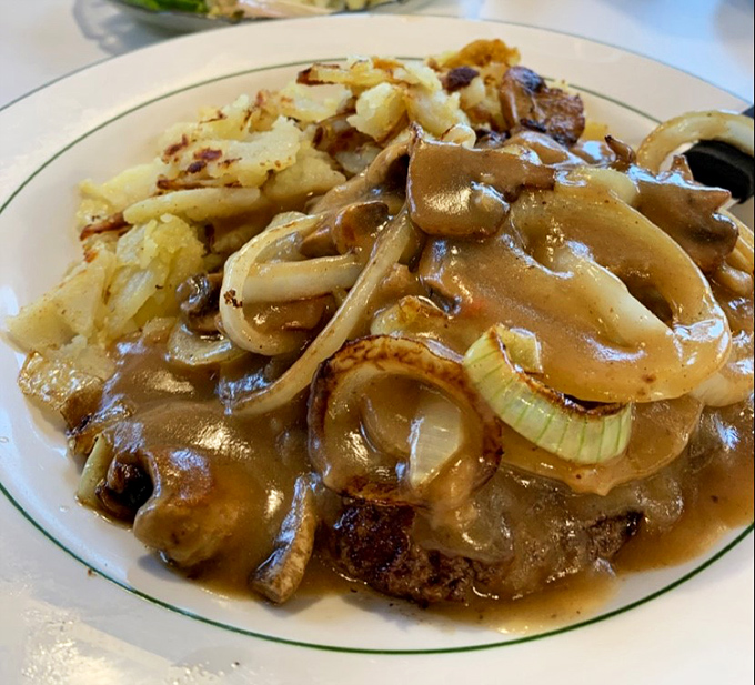 Salisbury steak swimming in savory gravy with those perfectly caramelized onions&mdash;TV dinners of your childhood just called to apologize for the comparison.