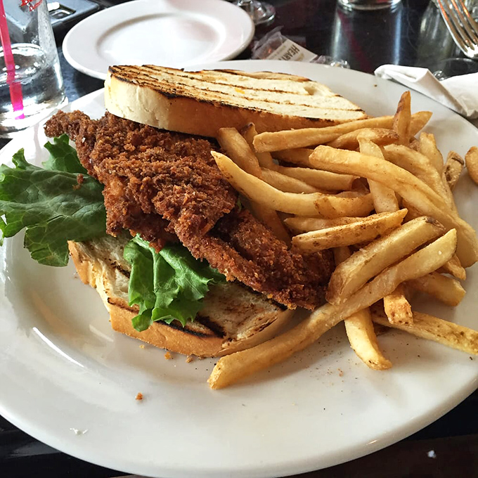 Not just any sandwich&mdash;a masterclass in crunch, with perfectly fried fish nestled between grilled bread and accompanied by hand-cut fries.