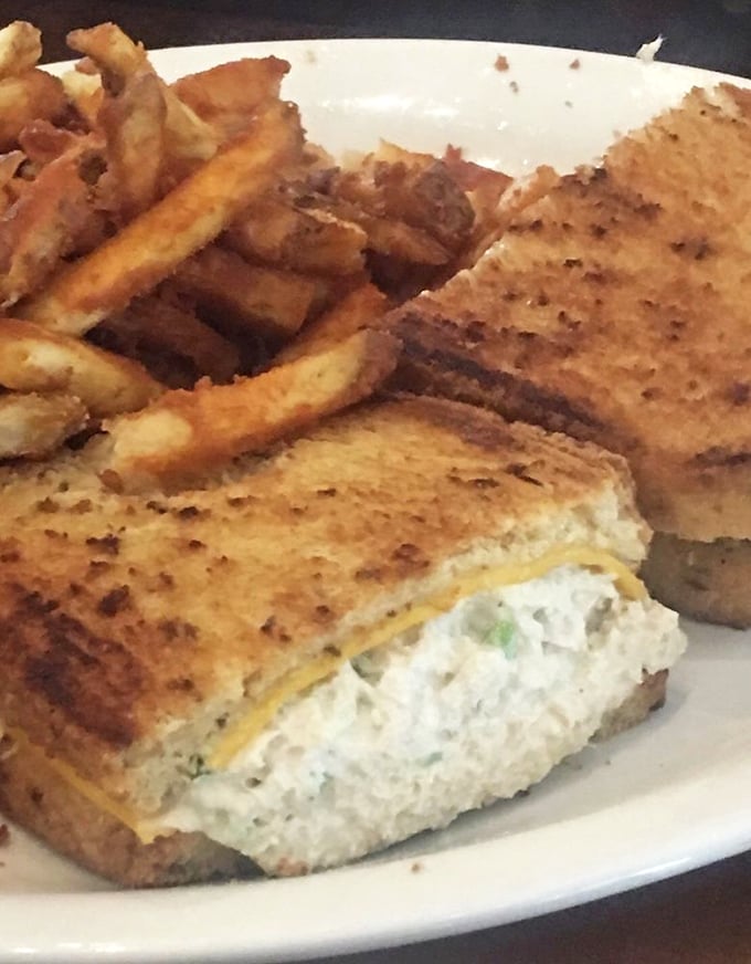 This golden-grilled sandwich isn't just lunch&mdash;it's edible architecture. Crispy exterior, creamy filling, and fries that deserve their own fan club.