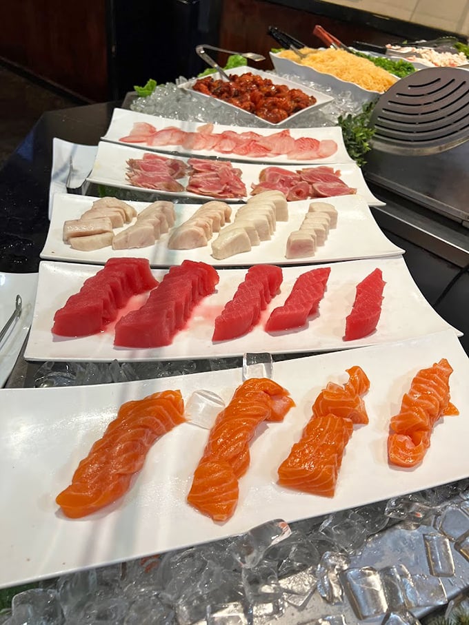 Fresh sashimi lined up like swimmers at the starting blocks, each slice of fish more vibrant than the last. This isn't just food&mdash;it's ocean poetry.