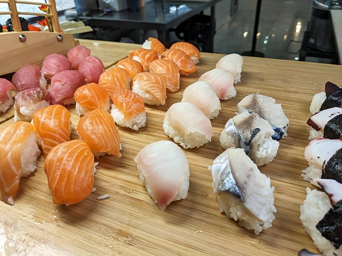 Sushi that looks like it belongs in a photo shoot, not a buffet line. These colorful morsels of salmon, tuna, and white fish await their close-up.
