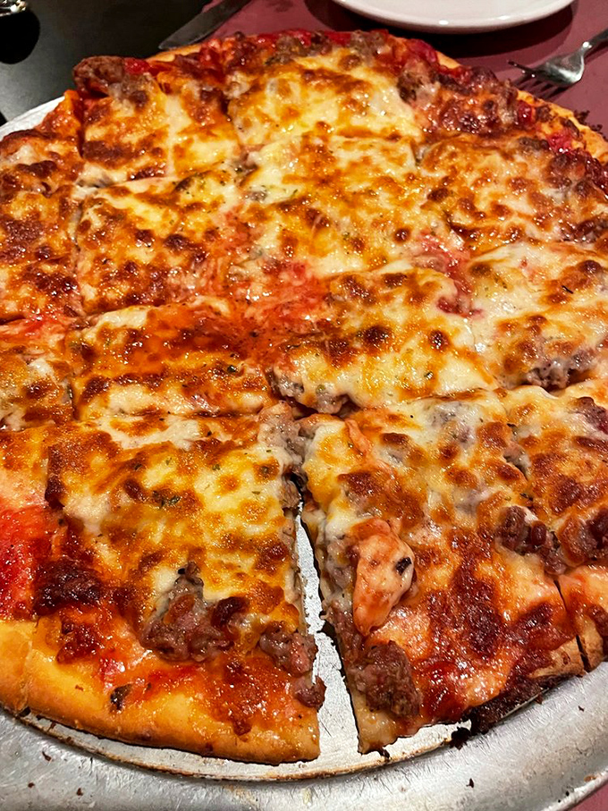 Behold the sausage pizza at Lino's – where cheese stretches into infinity and the crust achieves that perfect balance between crisp and chewy. Worth every calorie.