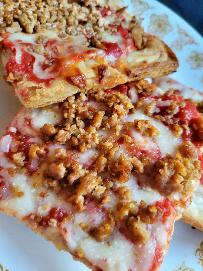 The star of the show: that legendary sausage pizza with its perfectly spiced meat that's made grown adults drive across state lines.