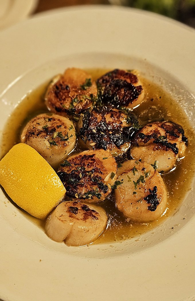 Plump, caramelized scallops swimming in buttery broth with a bright lemon wedge &ndash; seafood this good in landlocked Ohio feels like a delicious magic trick.