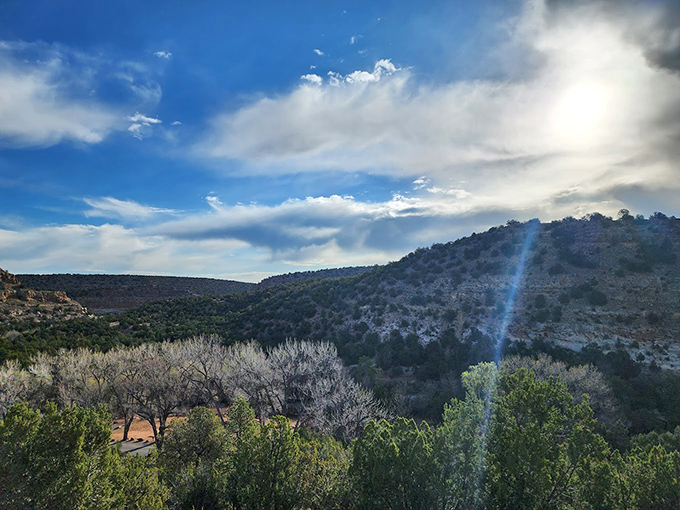 Dramatic skies frame the rugged landscape, creating the kind of view that makes smartphone cameras feel wholly inadequate.