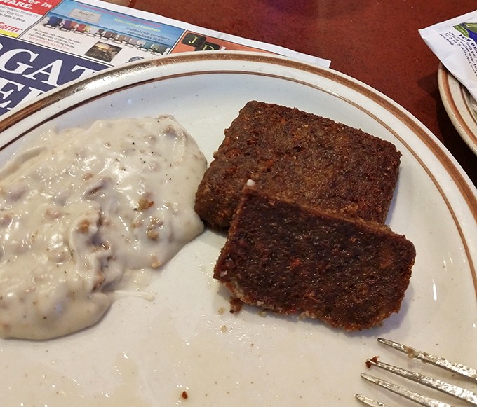 Scrapple and gravy&mdash;Delaware's answer to the question "What happens when breakfast meets culinary courage?" A regional delicacy worth exploring.