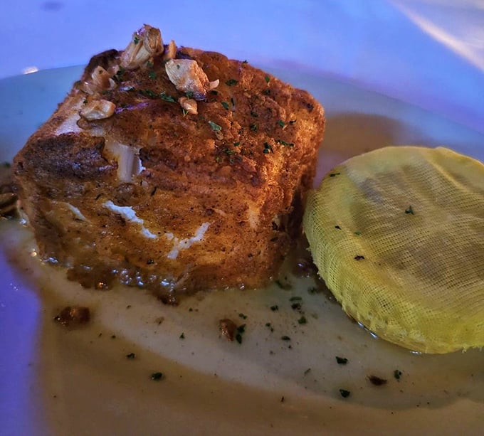 Some beach towns give you fish in paper baskets. New York Prime gives you sea bass on fine china. Upgrade accepted.