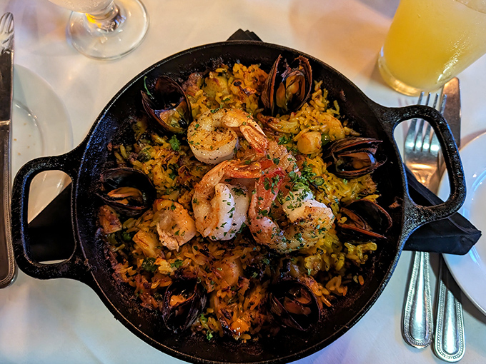Seafood paella that would make a Spanish grandmother nod in approval—a cast iron skillet of maritime treasures nestled in saffron-kissed rice.
