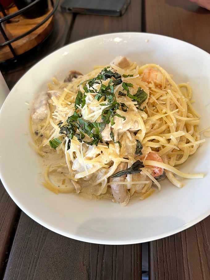 Pasta swimming in creamy sauce with seafood playing hide and seek throughout. Carbs and protein having their best day ever.